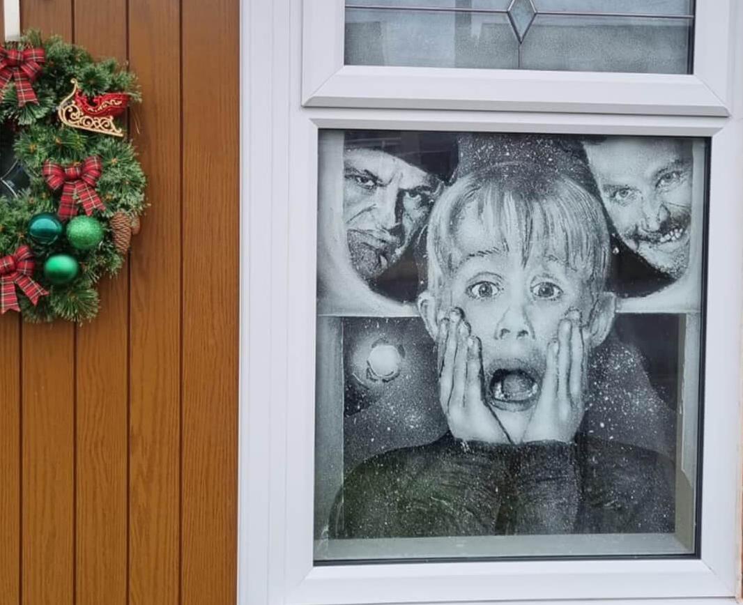 Snow Graffiti Artist Creates Christmas Window Displays