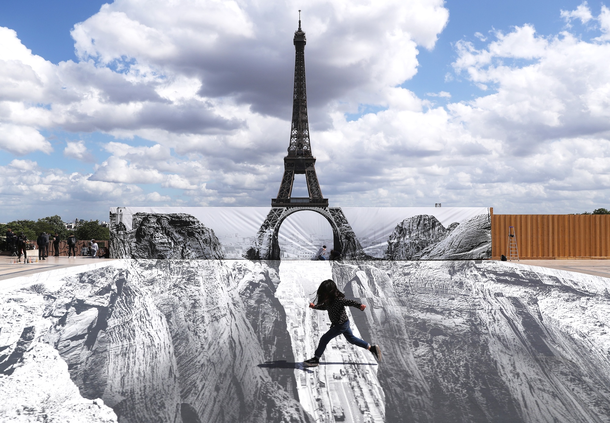 French Street Artist JR Brings People Together Through His Work